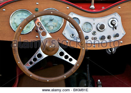 Steering wheel and dashboard of an MG TD sports car from the early ...