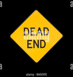 yellow and black dead end road sign in the desert with bullet holes ...