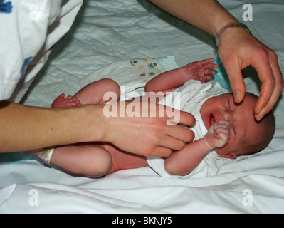 Newborn baby being changed Stock Photo - Alamy