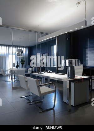 Office environment with tables, desks, chairs and computers Stock Photo ...