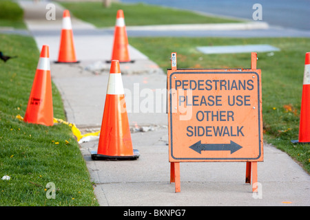 pedestrians please use other side walk orange sign broken road orange ...