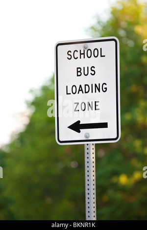 A bus zone and loading zone sign outside the public (Primary) school in ...