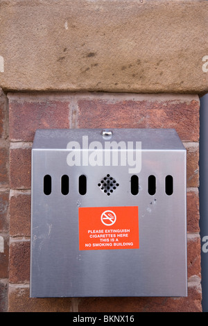 Cigarette waste bin outside an office front entrance Stock Photo - Alamy