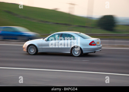 Blue Mercedes saloon on the M62 Stock Photo - Alamy