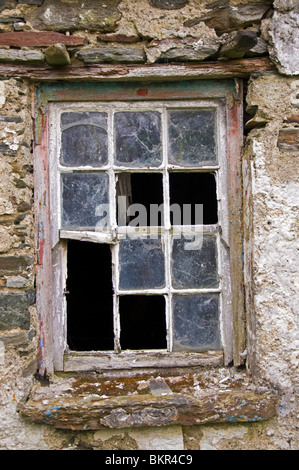 Broken glass window on a cottage Stock Photo - Alamy