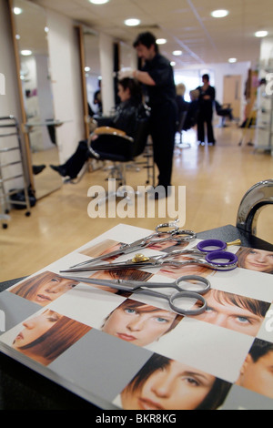 Close-up of hairdressing scissors on a black background Stock Photo - Alamy