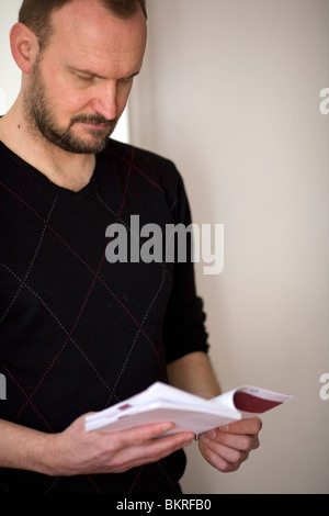 reading the booklet of manual Stock Photo - Alamy