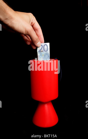 charity collection tin with twenty euros Stock Photo - Alamy