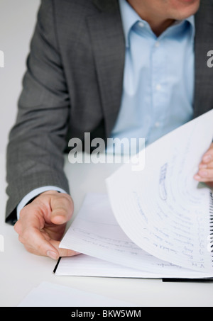 Looking through papers Stock Photo - Alamy