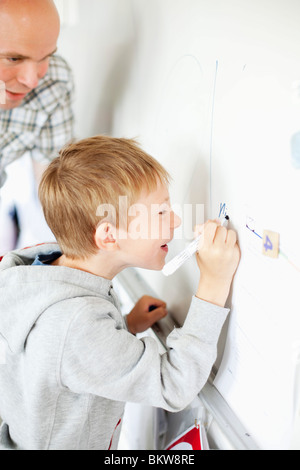 Children holding a whiteboard Stock Photo - Alamy