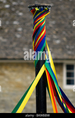 The top of a maypole with coloured ribbons Stock Photo - Alamy