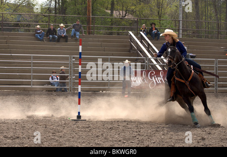 Teenage high school girl competes in barrel racing Stock Photo - Alamy