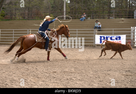 Teenage high school girl competes in barrel racing Stock Photo - Alamy