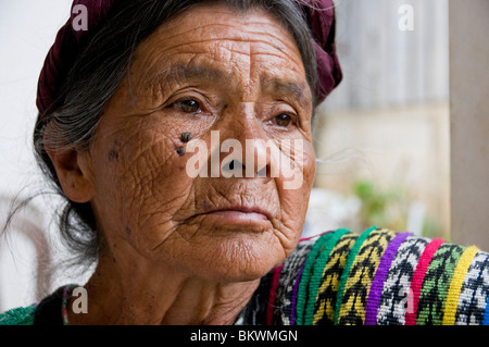 Street portrait of elderly Mayan woman in traditional clothing: hand ...