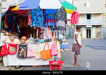 Dominica, Caribbean, Roseau market woman carrying a large stalk of ...