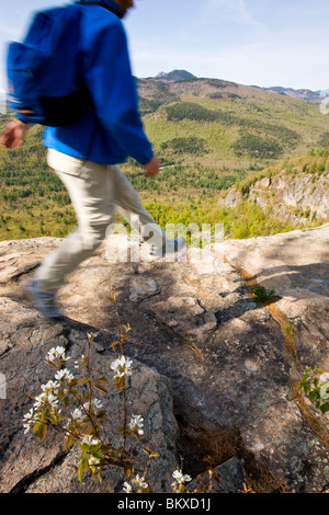 A hiker on the Boulder Loop Trail in New Hampshire's White Mountains ...