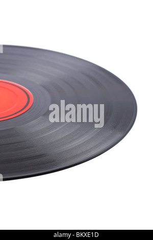 Dusty vinyl record with red label isolated on white background. Shallow ...