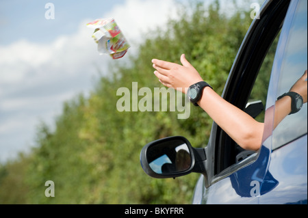 Somebody throwing litter out of a car window Stock Photo - Alamy