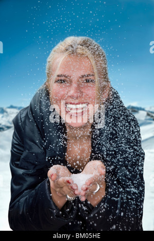 portrait of girl catching snow flakes on tongue in front yard Stock ...