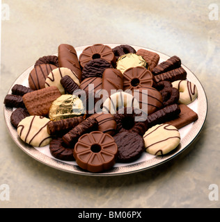 a selection of foil wrapped dark and milk chocolate round biscuits ...