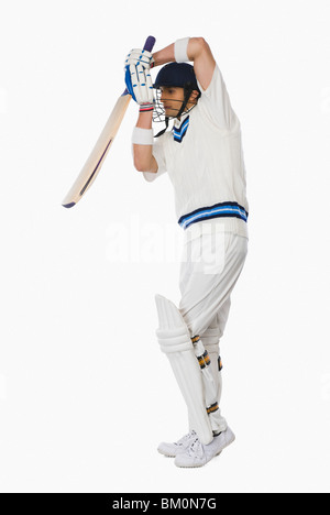 Cricket batsman playing backward defensive stroke Stock Photo - Alamy