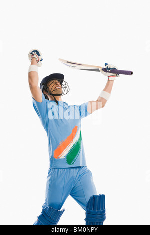 Cricket batsman waving his arms in celebration Stock Photo - Alamy