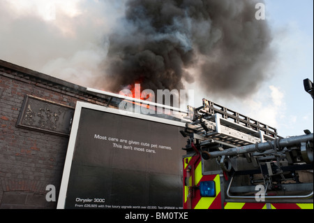 Advertising Billboard on fire with flames & smoke Stock Photo - Alamy