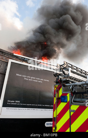 Advertising Billboard on fire with flames and smoke Stock Photo - Alamy