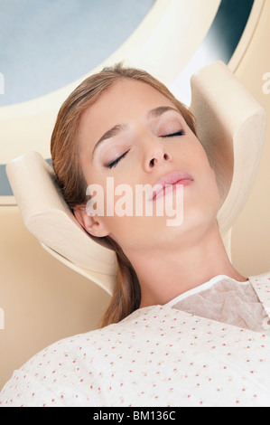 MRI scan. Lying on his back, a man enters the extra-wide chamber of an ...
