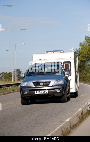 Car towing caravan on european motorway Stock Photo - Alamy