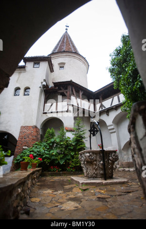 A low-angle view of Bran Castle seen on a beautiful sunny day Stock ...