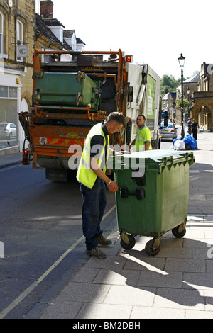 Dustbin workers collecting bags of rubbish Stock Photo - Alamy