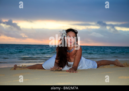 forty year old woman doing splits on the beach at sunrise Stock Photo ...