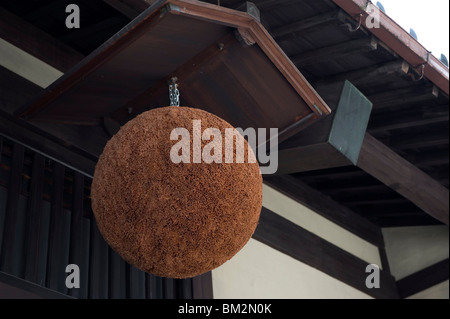 Traditional sake shop with cedar ball sign and shop entry curtain in ...