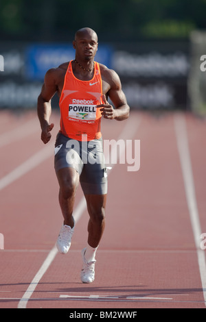 Asafa Powell (JAM) competing in the Men's 100m Round 1 at the Olympic ...