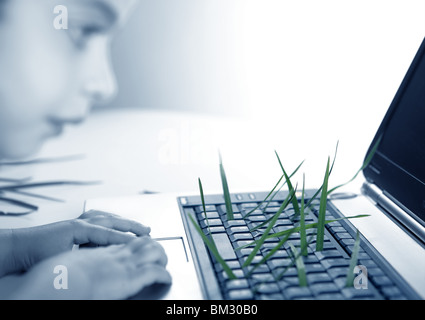 Grass growing from computer keyboard, ecology metaphor Stock Photo - Alamy