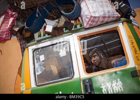 Exhibit of a "bush taxi" loaded with passengers and cargo at the ...