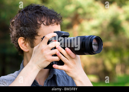Sneaky photographer getting his shot of nature Stock Photo - Alamy