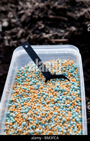 Close up of slow release fertiliser for growing plants, ready for ...