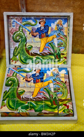 Square block puzzle toy on table with yellow wall background Stock ...