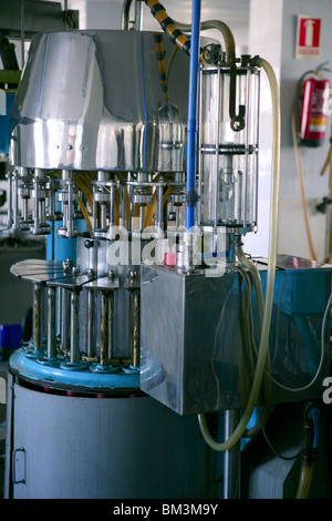 Industrial bottling machine at modern wine factory in Italy, close up ...