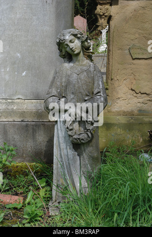 A statue in an English Victorian graveyard Stock Photo - Alamy