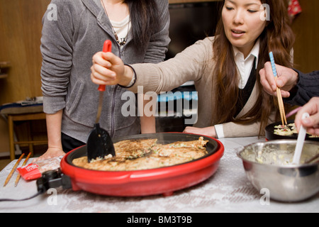 Japanese family cooking dinner Stock Photo - Alamy