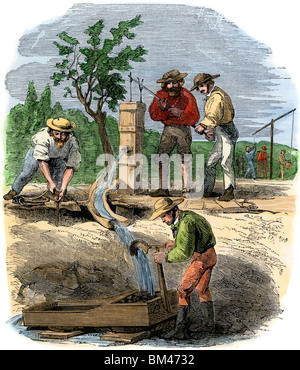 Australian prospectors panning for gold, 1850s. Hand-colored woodcut ...