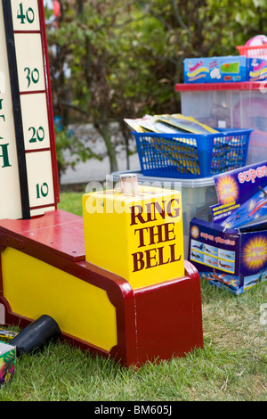 Carnival game of hit the bell Stock Photo - Alamy
