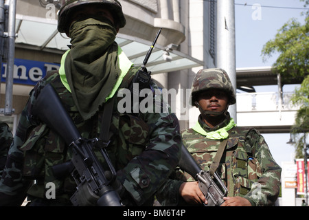 On May 19th, Thai soldiers rest in Chit Lom during a military assault ...
