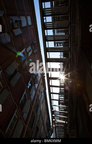 American alleyway with fire escape Stock Photo - Alamy