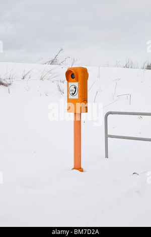 Orange SOS telephone booth by a road Stock Photo - Alamy