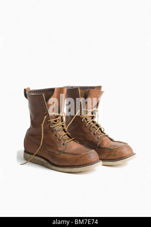 A pair of very worn work boots Stock Photo - Alamy