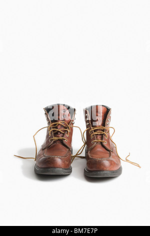 A pair of very worn work boots Stock Photo - Alamy
